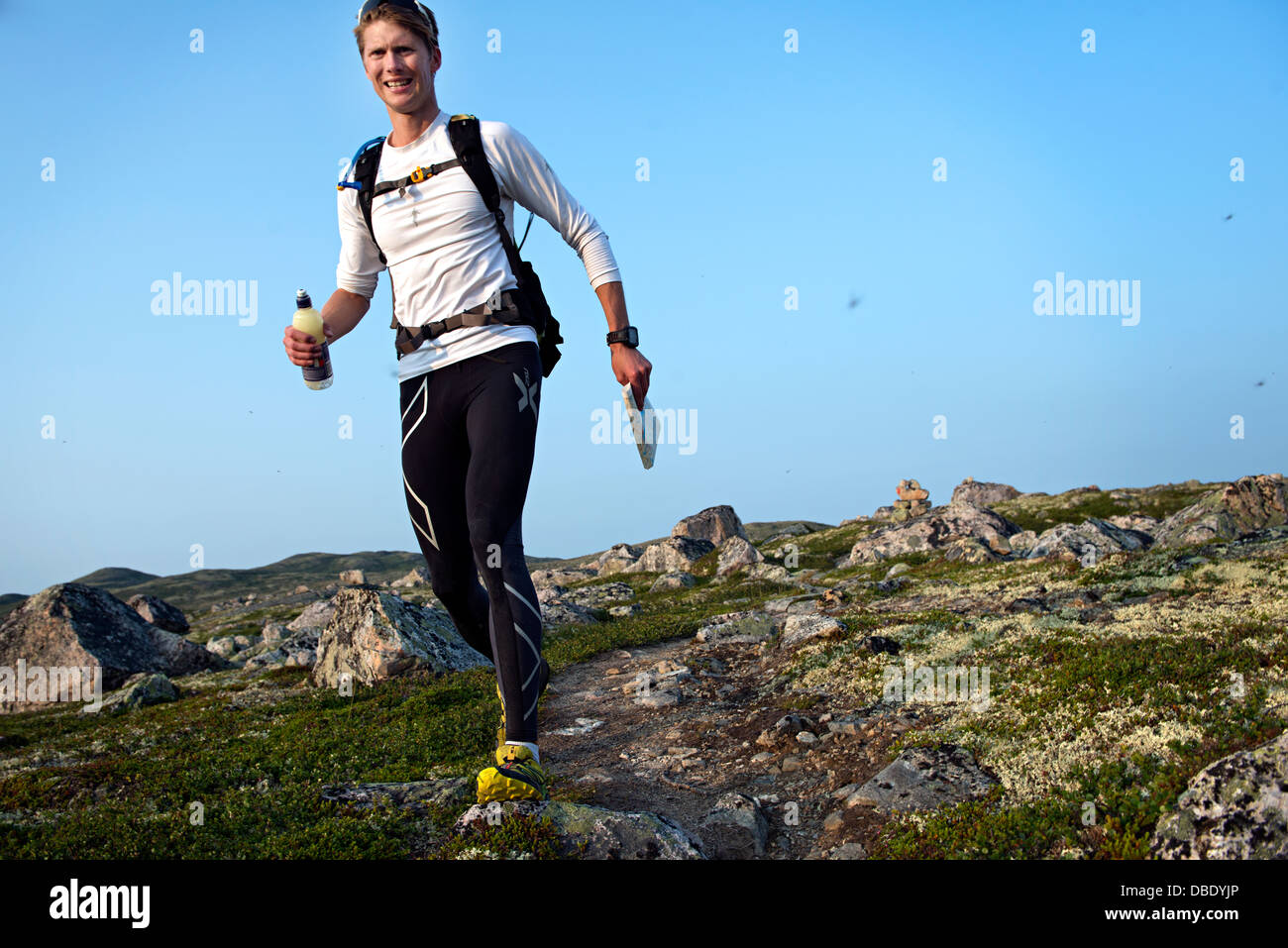 An athlete running on the Hardangervidda Plateau, Norway Stock Photo ...