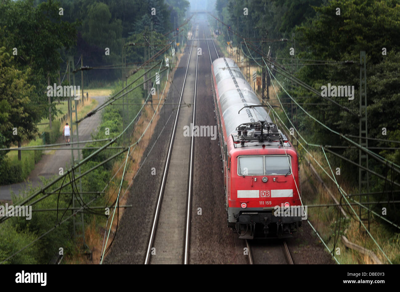 A train drives along the railway rout between Emmerich and Oberhausen ...