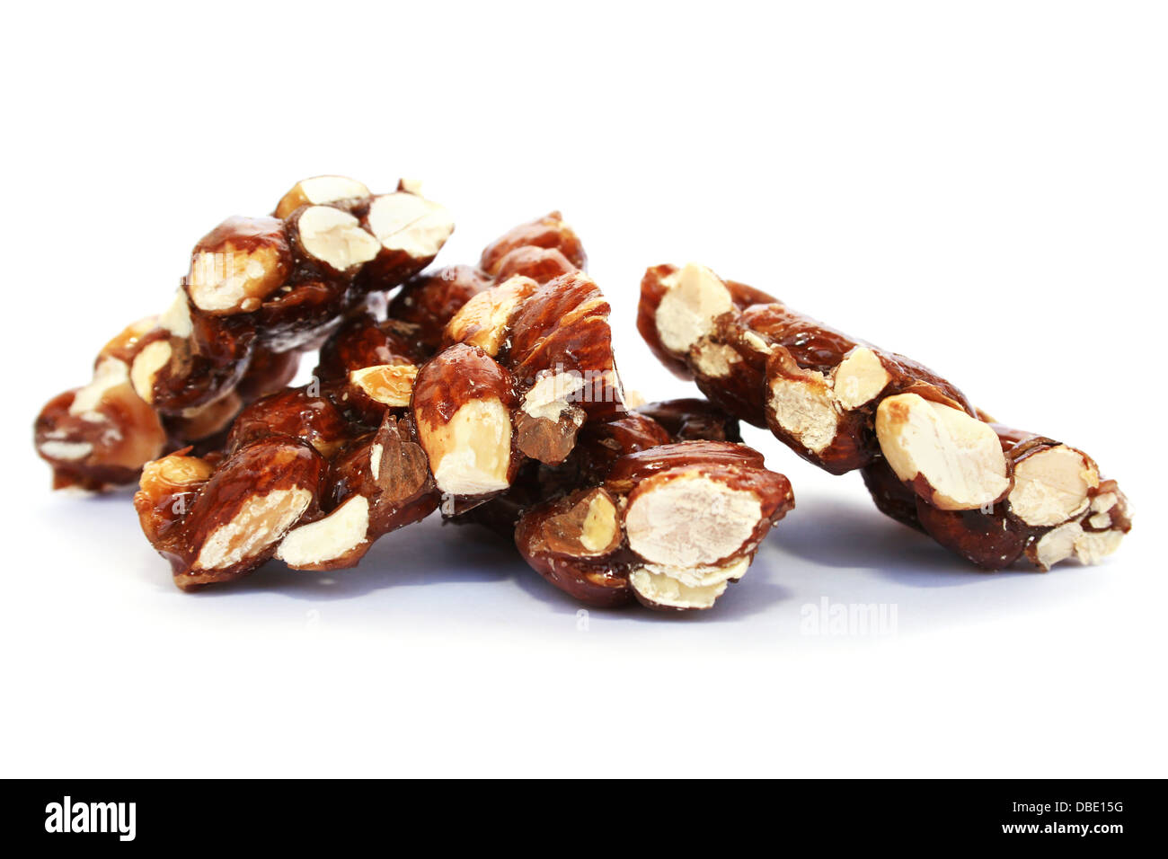 Candy with almonds isolated on white background Stock Photo - Alamy