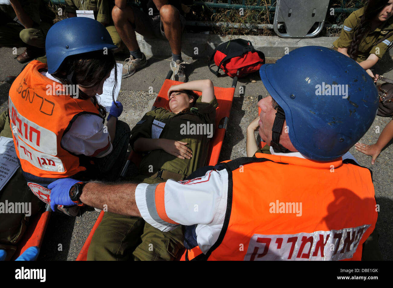 Wounded people being treated by first aid crew Stock Photo - Alamy
