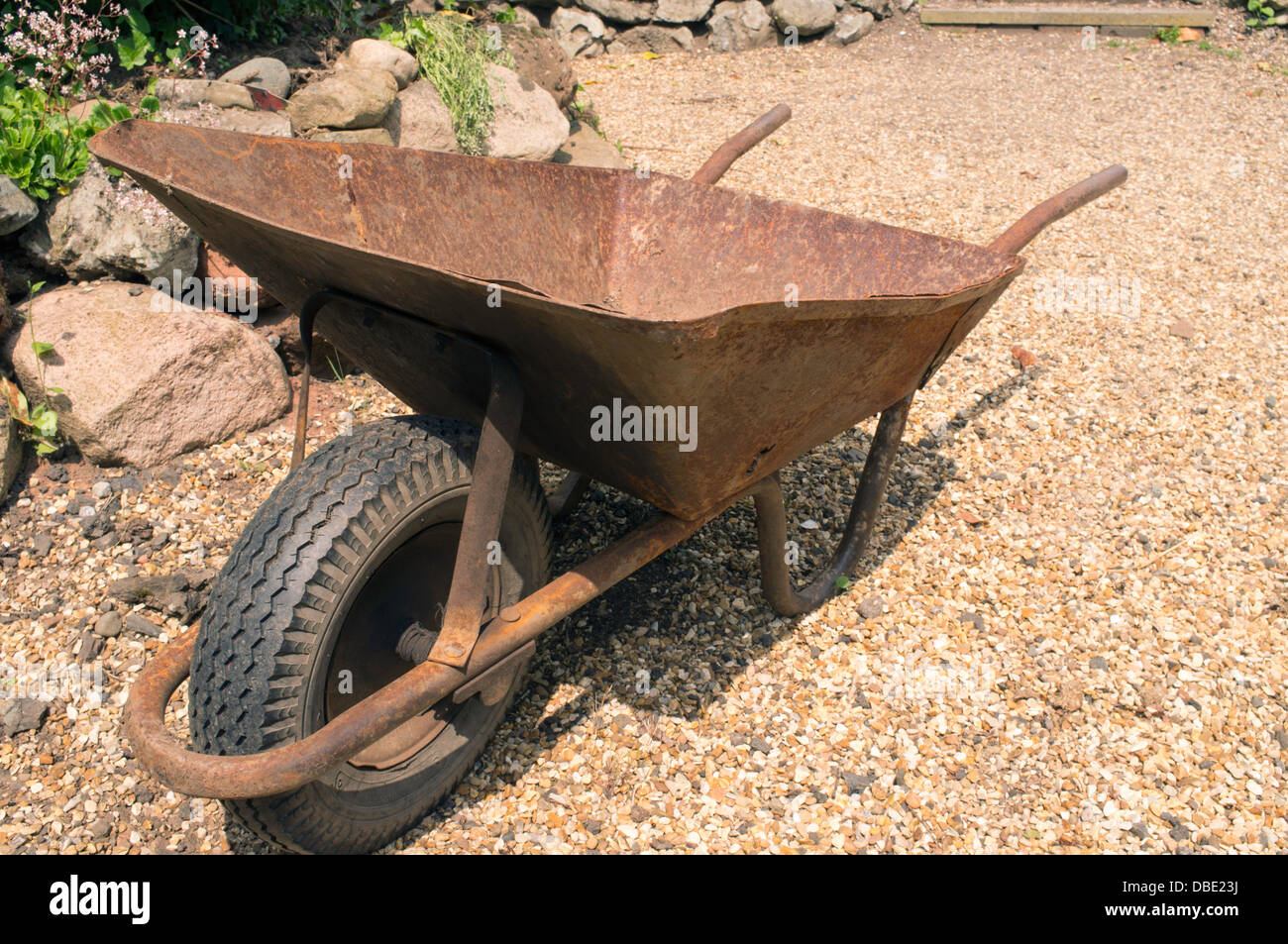 Rusty wheelbarrow, England, UK Stock Photo - Alamy