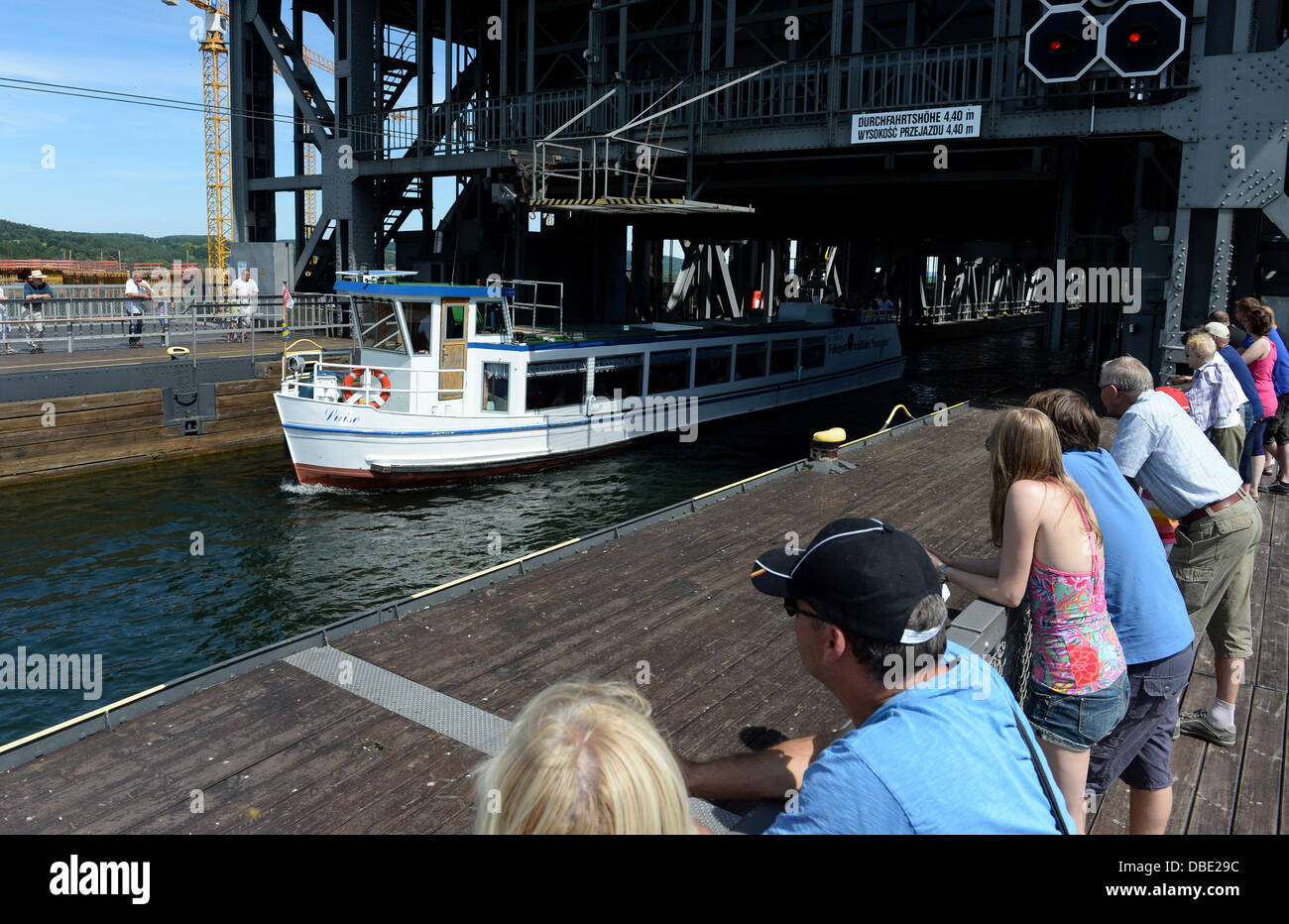 Visitors observe the passage of ships through the ship canal lift in ...