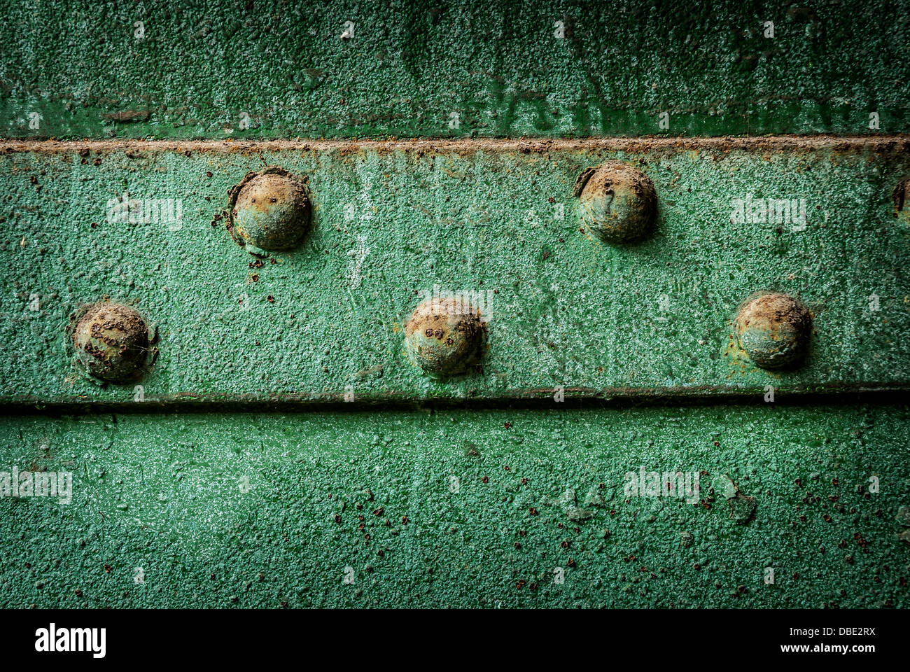 Cast iron industrial rivet rust and peeling green paint background ...