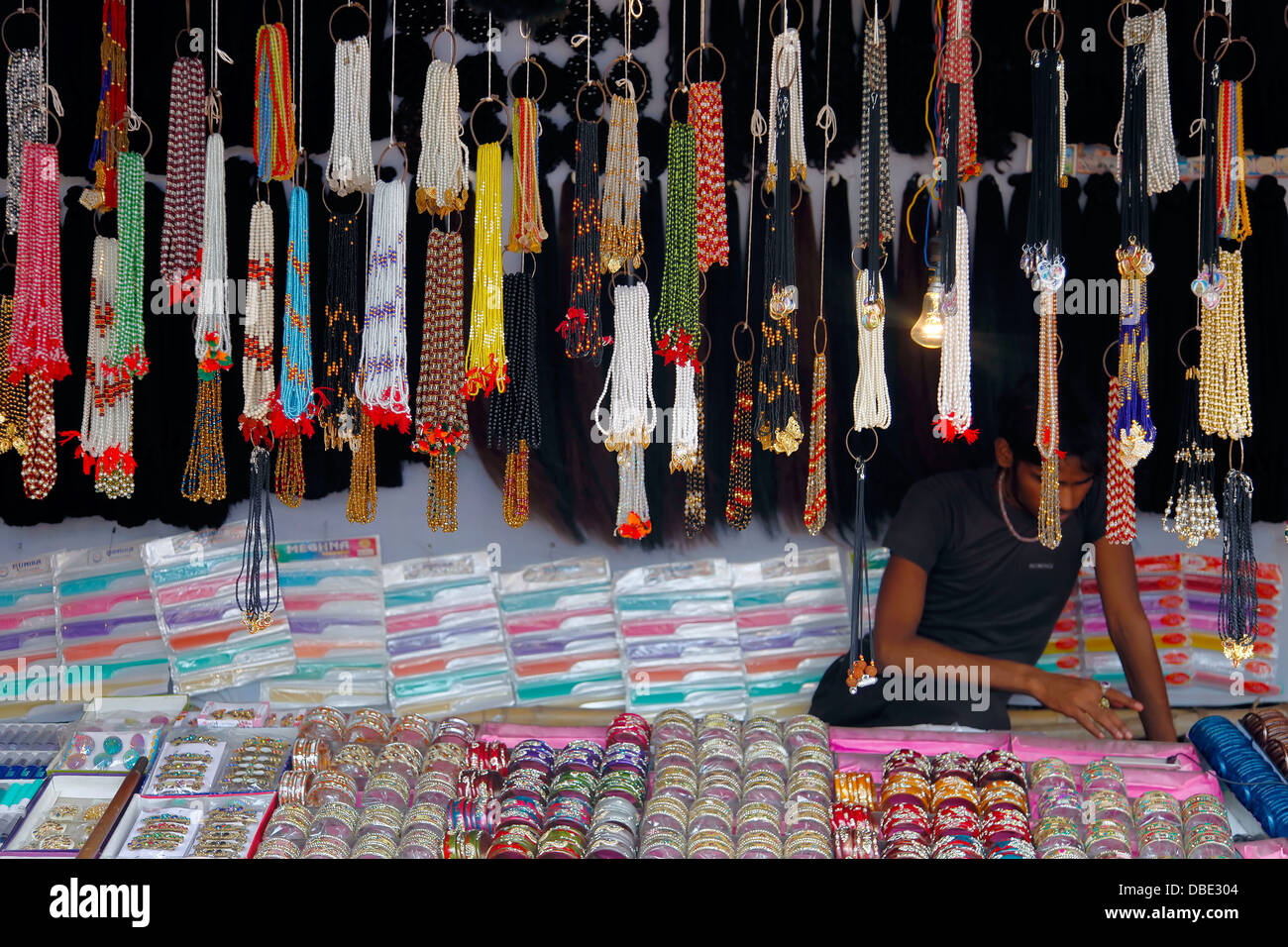 Trinkets on sale at a Indian stall Stock Photo - Alamy