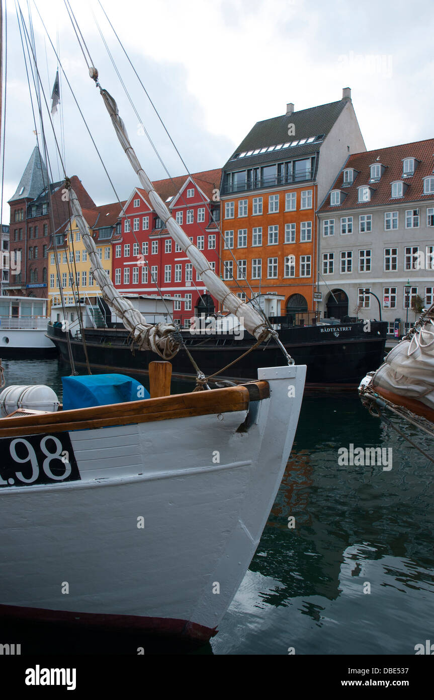 Denmark. Copenhagen. Nyhavn. Sailboat and the townhouses that line the ...