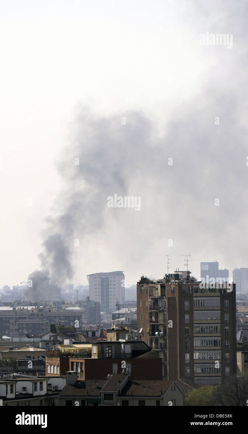 Large plume of smoke seen over Milan. Italy Stock Photo - Alamy
