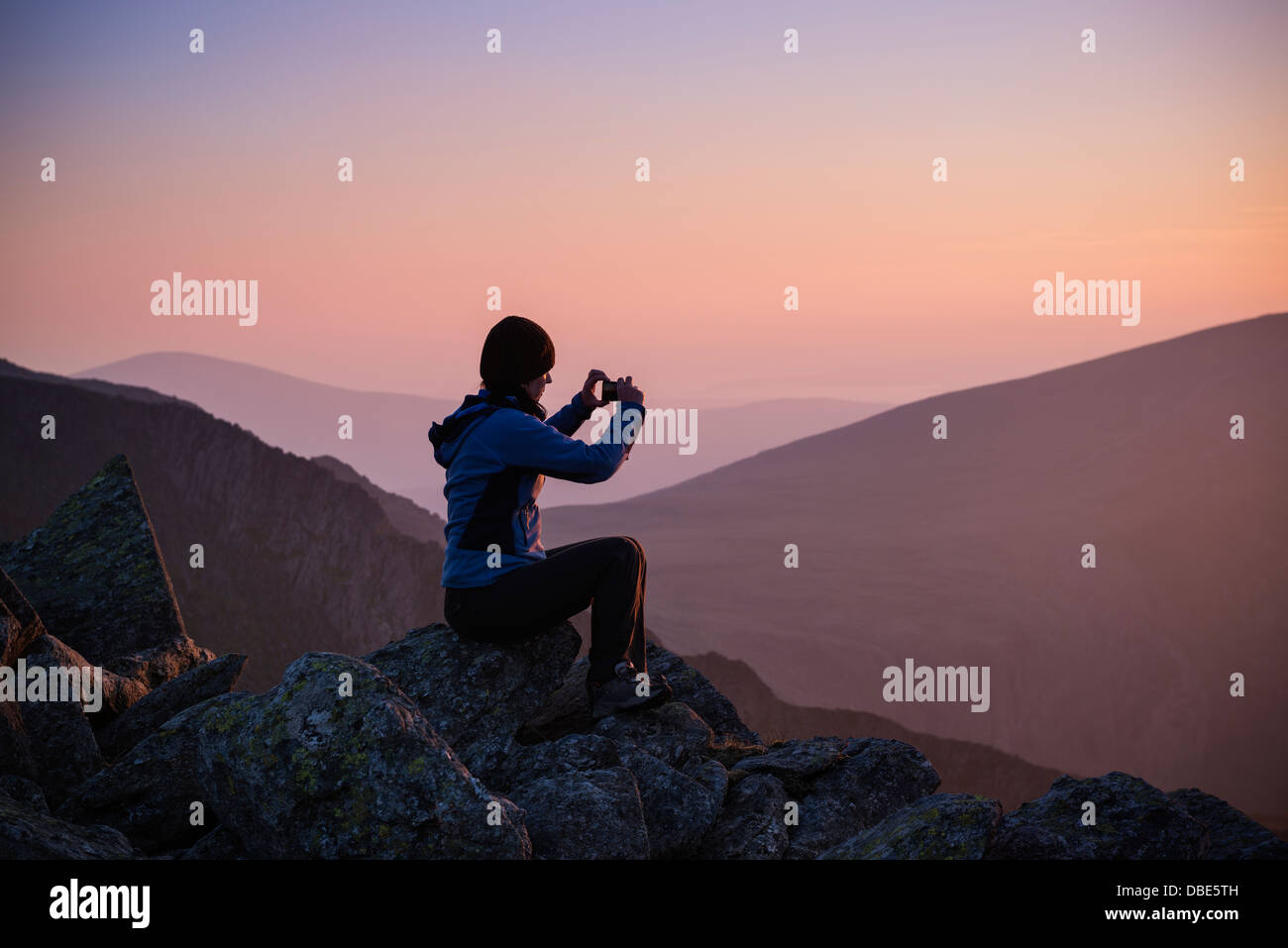 Hiker sitting sunset hi-res stock photography and images - Alamy