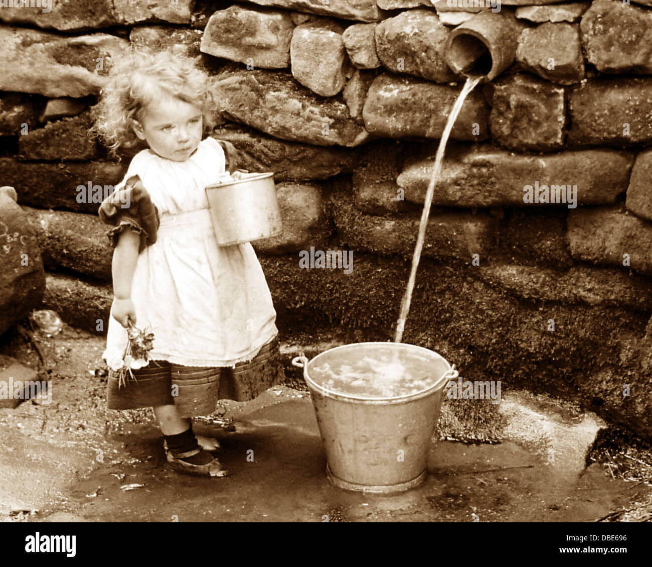 Little Girl at the Well Victorian period Stock Photo - Alamy