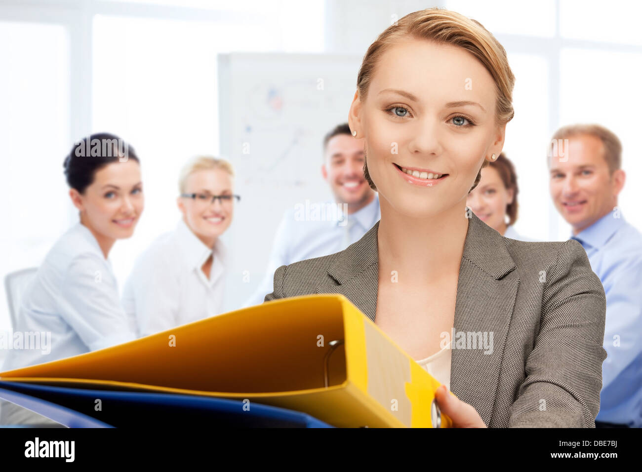 woman with folders in office Stock Photo - Alamy