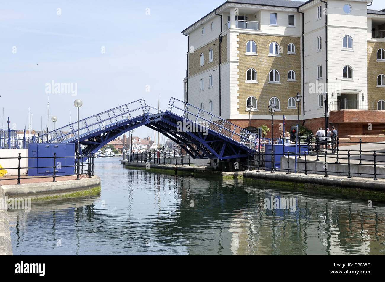 Raised bridge lowering to allow pedestrian traffic across Stock Photo ...