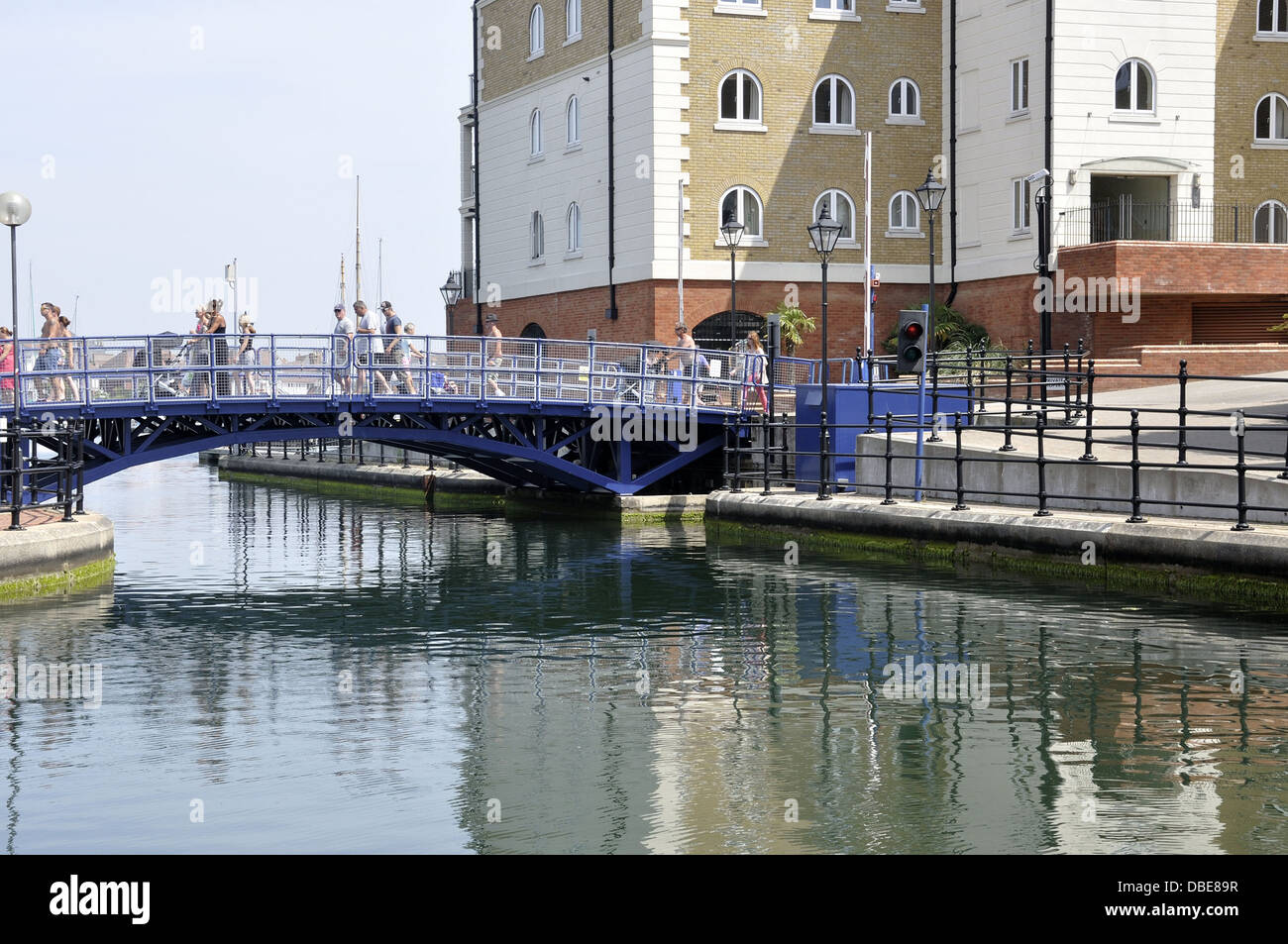 Pedestrian traffic on footbridge over water Stock Photo - Alamy