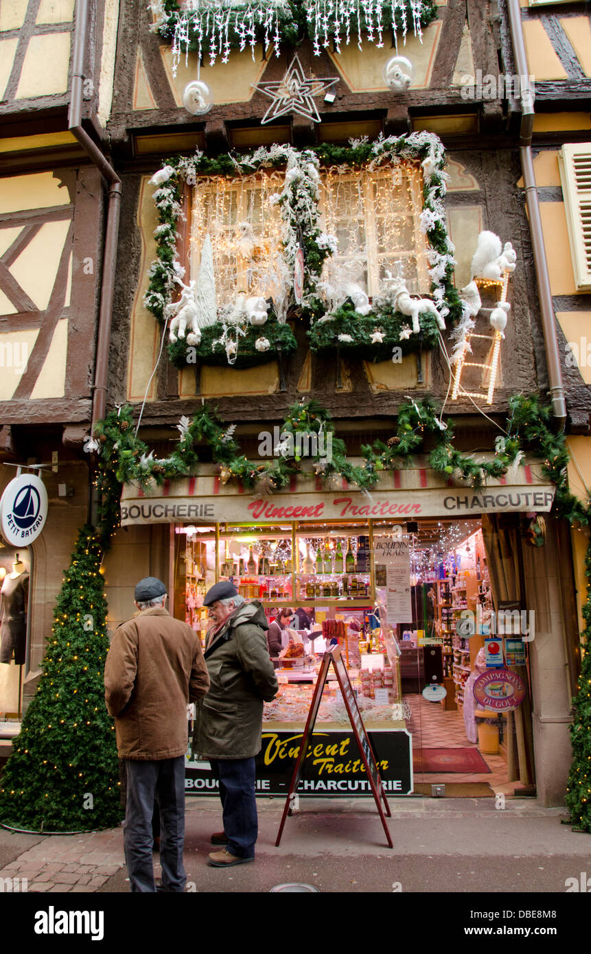 France, Alsace, Colmar. Christmas decorations on typical historic half ...