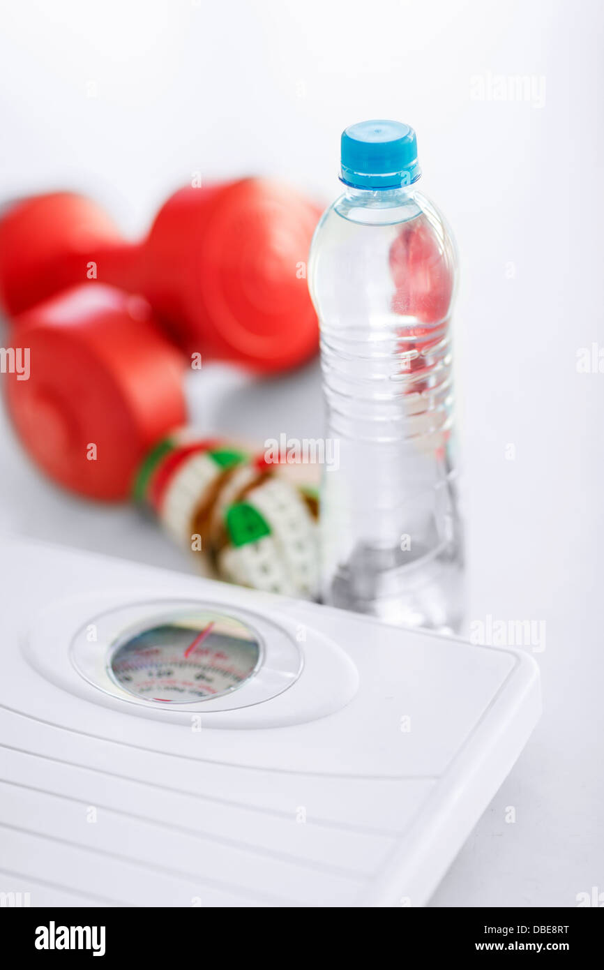 scales, dumbbells, bottle of water, measuring tape Stock Photo - Alamy