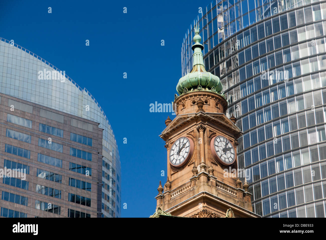 Clock tower of Lands Department building with glass fronted skyscraper ...