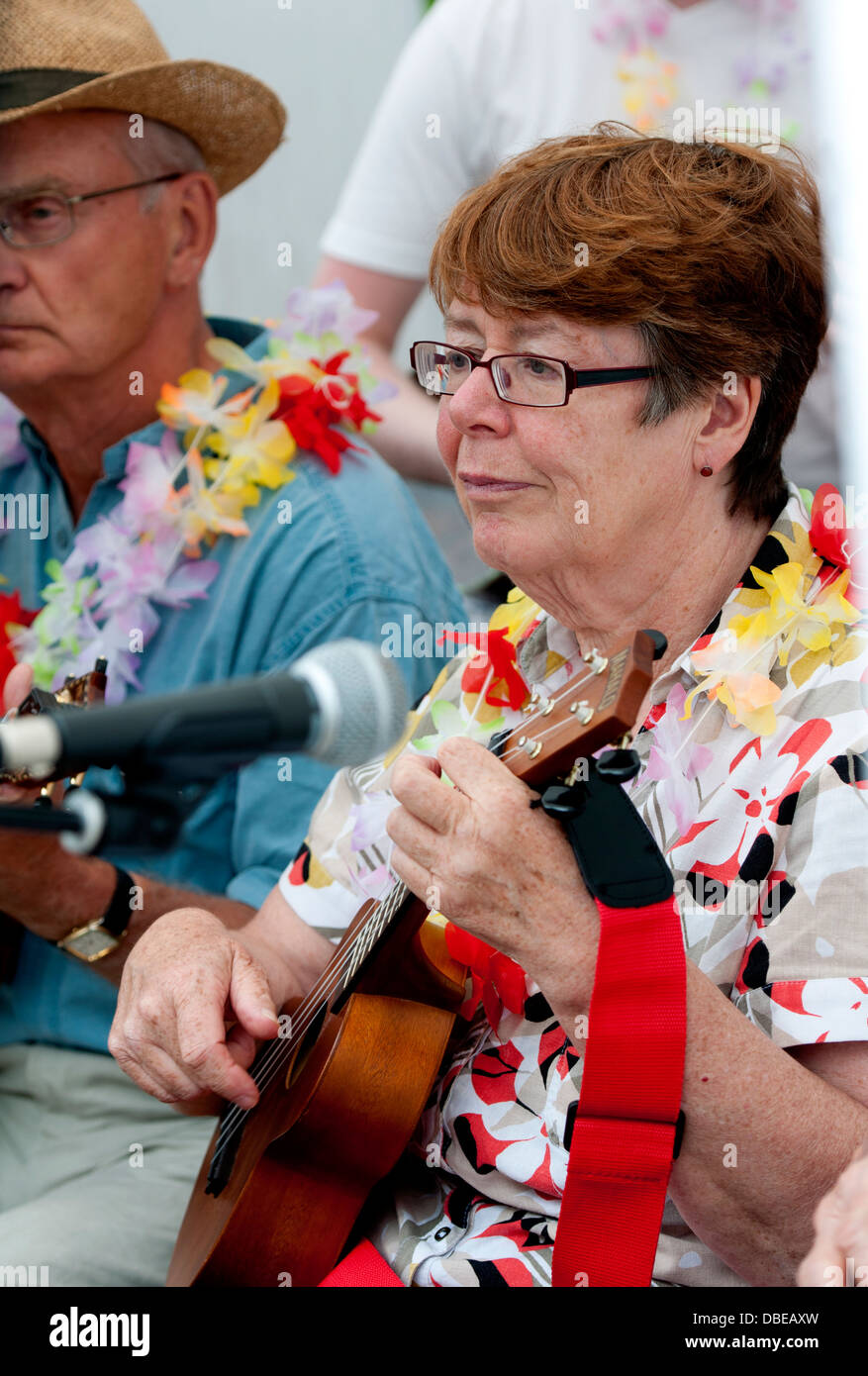 Woman playing a ukulele hi-res stock photography and images - Alamy