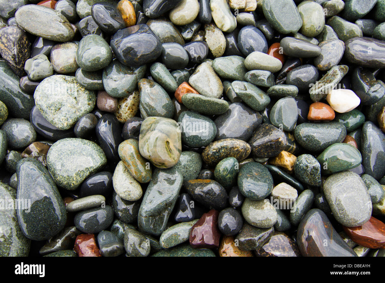 Natural colorful stones for background Stock Photo - Alamy