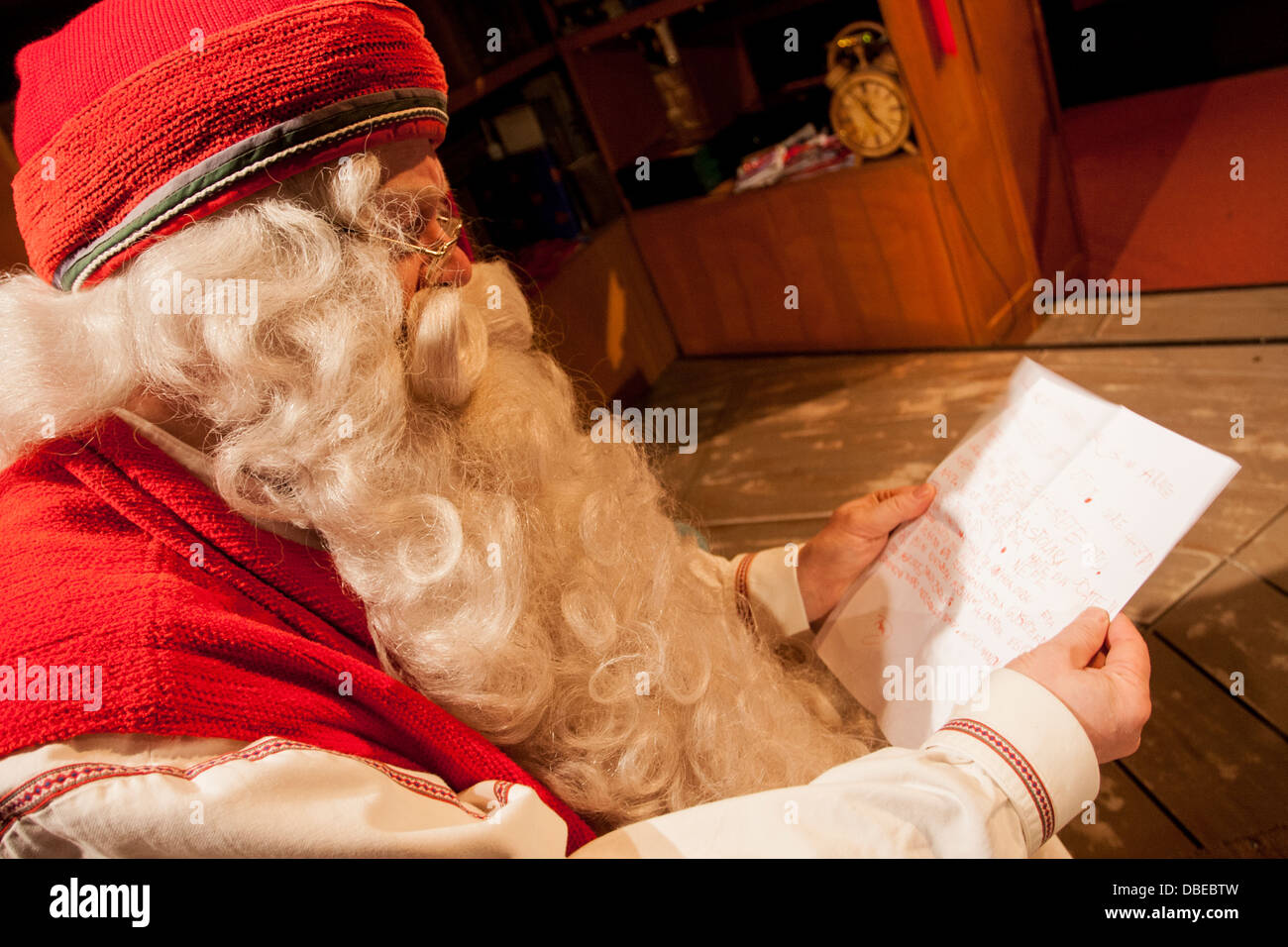 Santa Claus reading a letter, Santa's Home in Rovaniemi, Finland ...