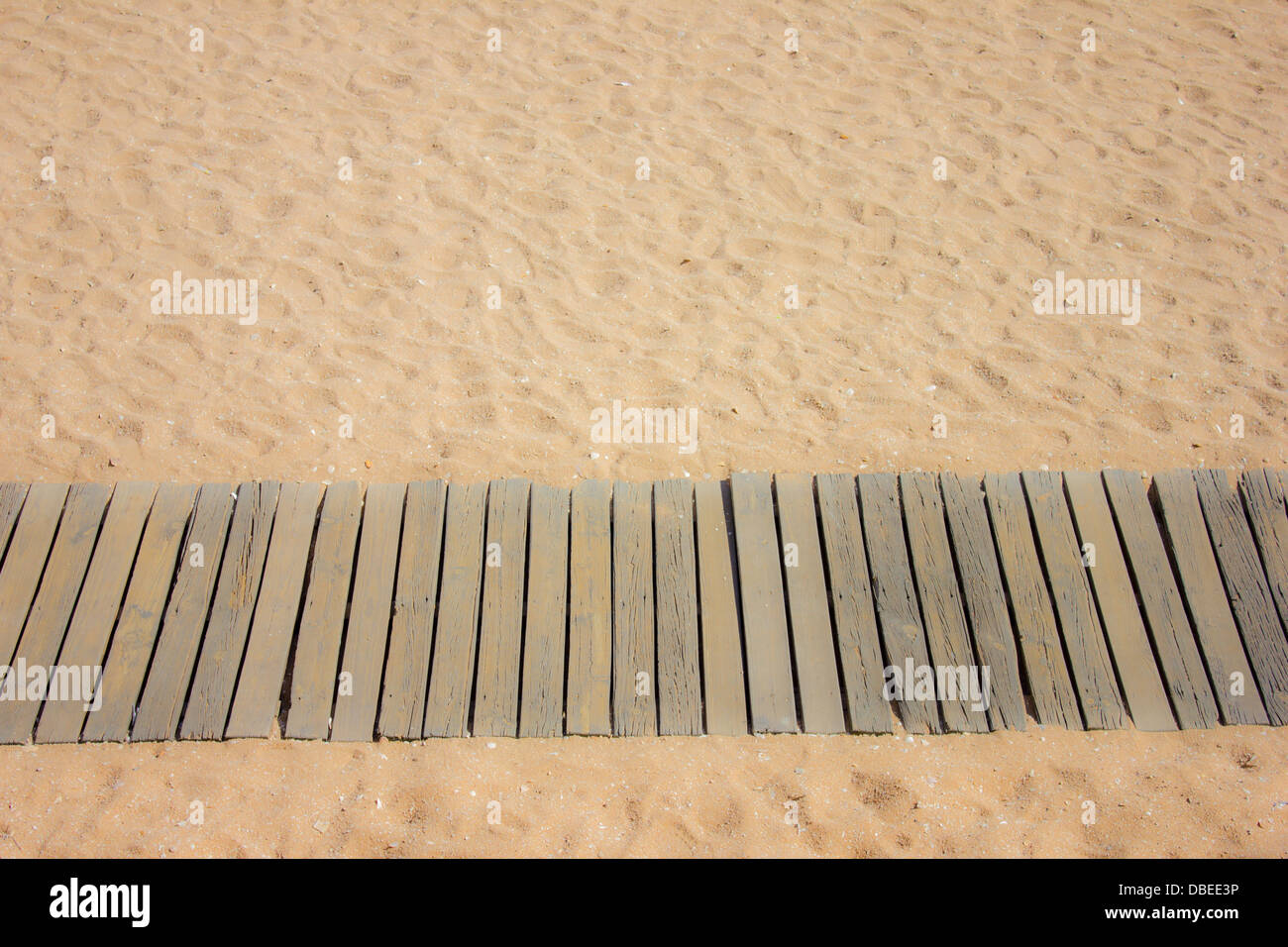 wood gangway in yellow sand Stock Photo - Alamy
