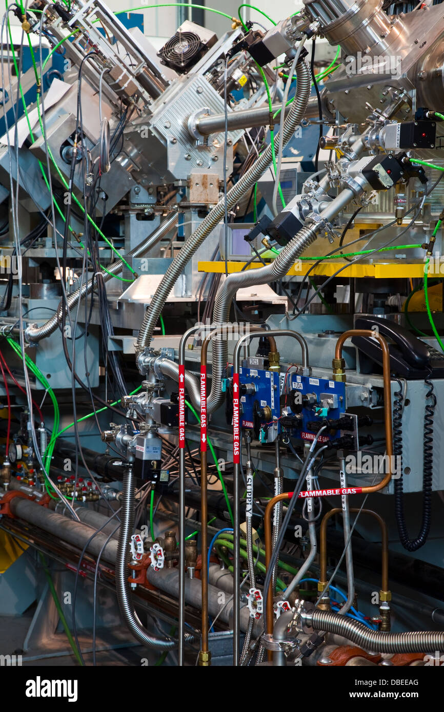 Abstract image of piping systems on a particle accelerator beam line ...