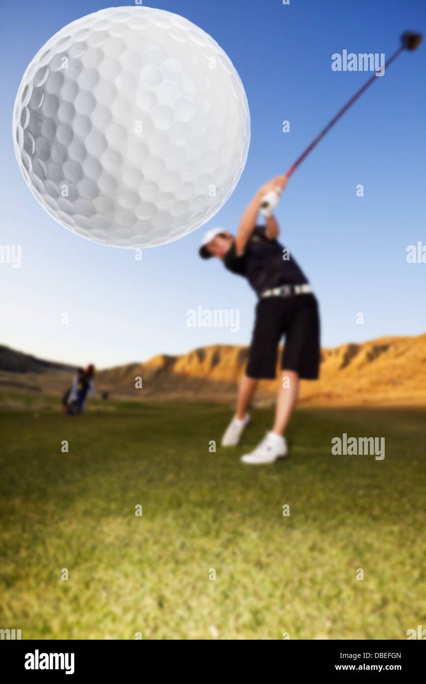 A golfer driving the ball down the fairway focus on the ball Stock ...