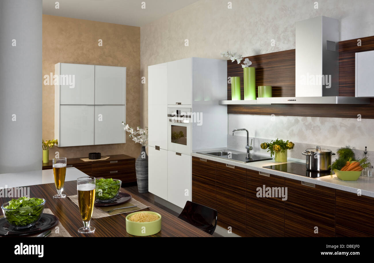 modern kitchen and living room with table served for dinner Stock Photo ...