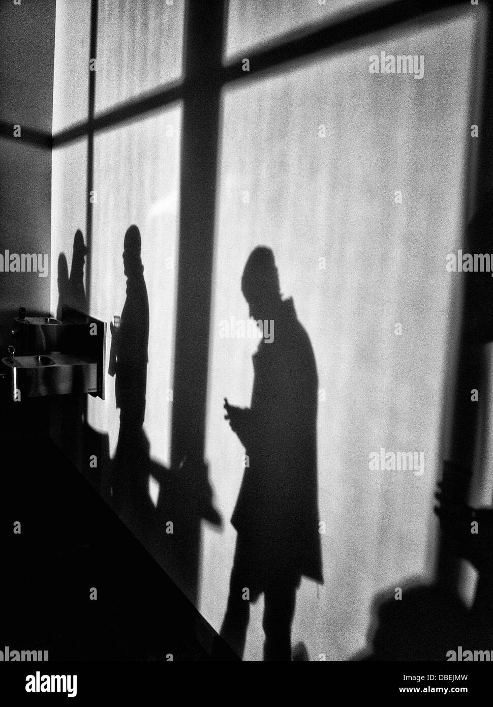 Shadows of people using cell phones Stock Photo - Alamy