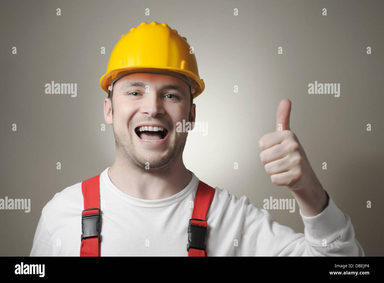 Happy young worker Stock Photo - Alamy
