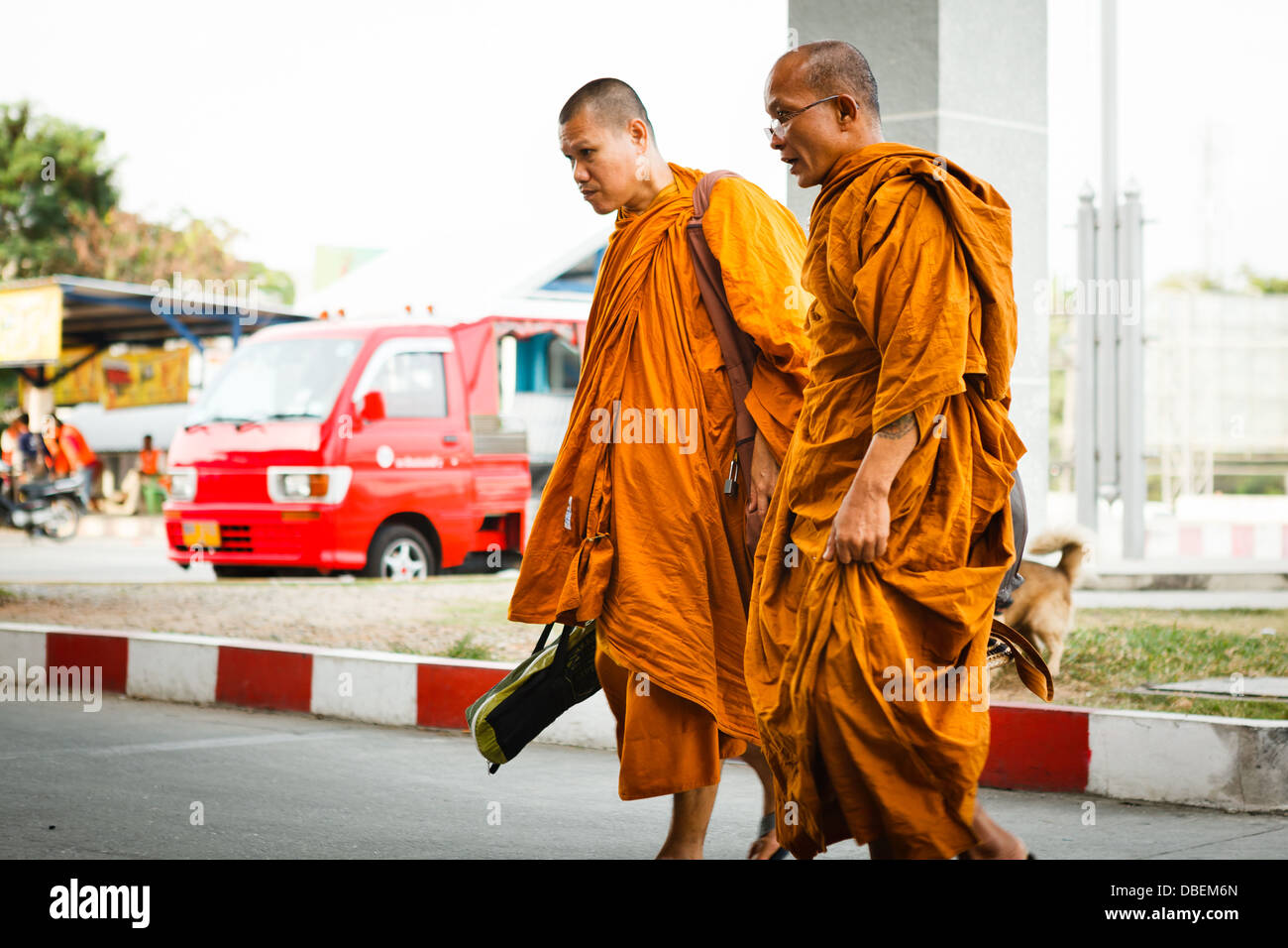 Two Buddhist monks walk to the bus stop Stock Photo - Alamy
