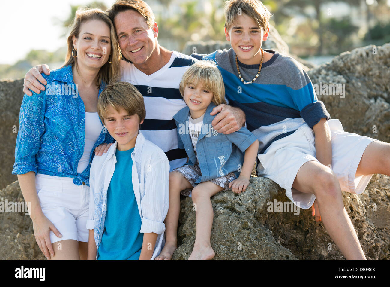 Family smiling together outdoors Stock Photo - Alamy