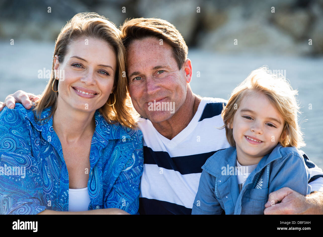 Family smiling together outdoors Stock Photo - Alamy