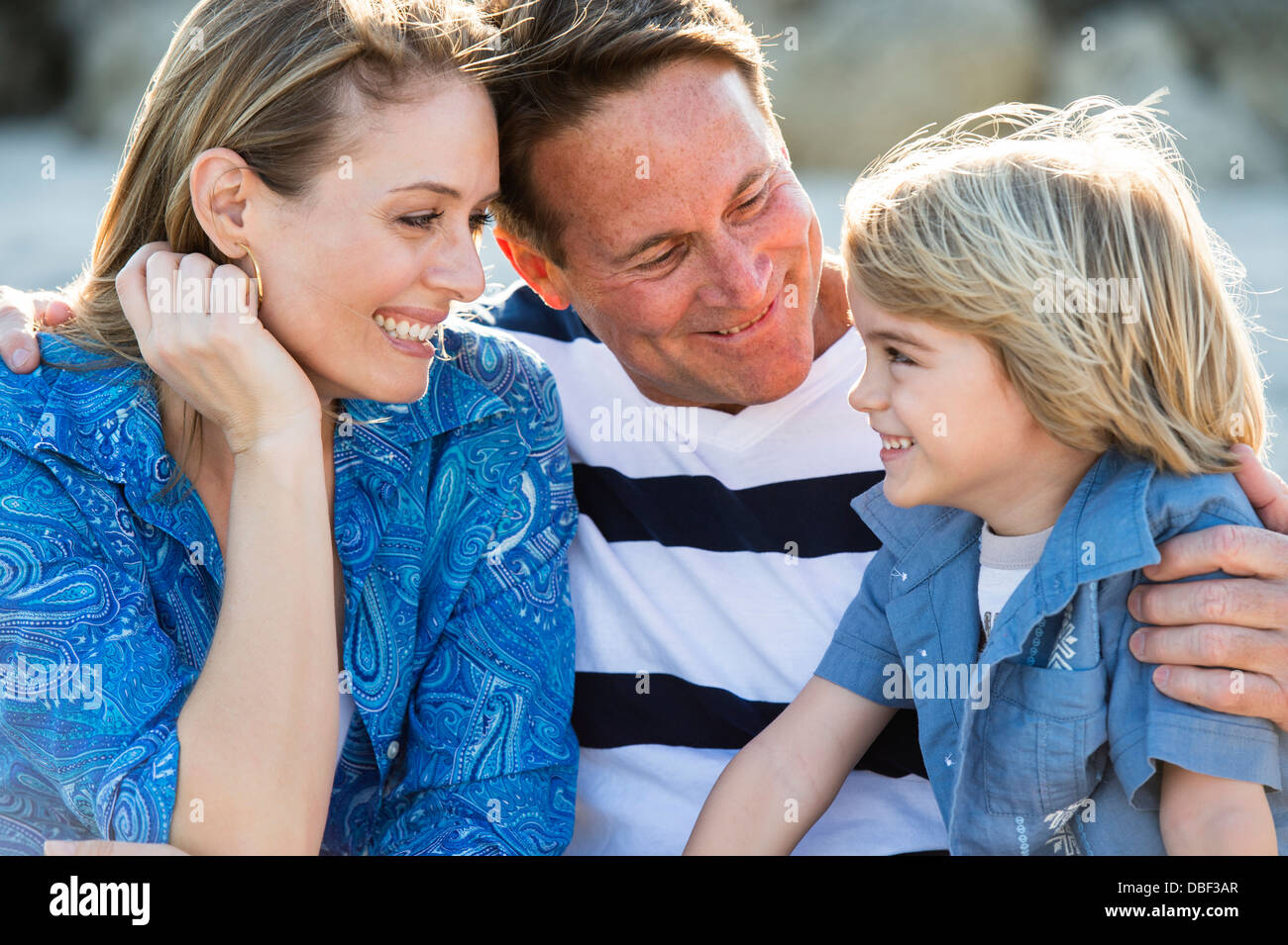 Family smiling together outdoors Stock Photo - Alamy