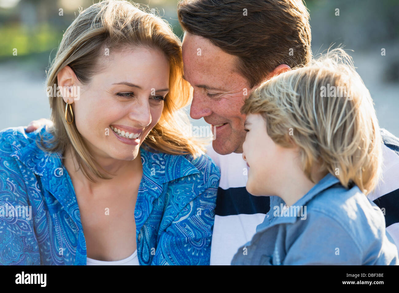 Family smiling together outdoors Stock Photo - Alamy