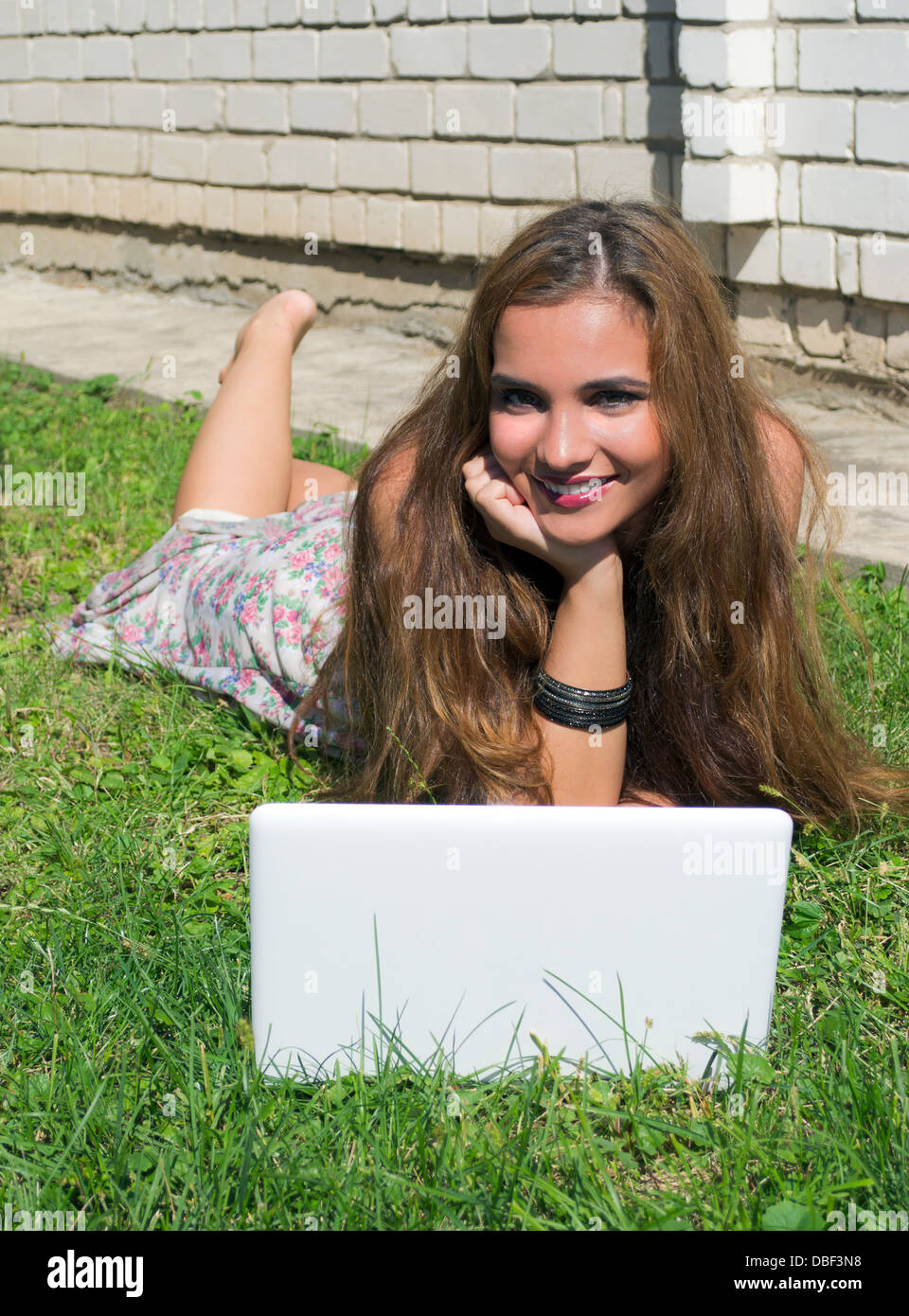 Beautiful girl with a laptop outdoor Stock Photo - Alamy