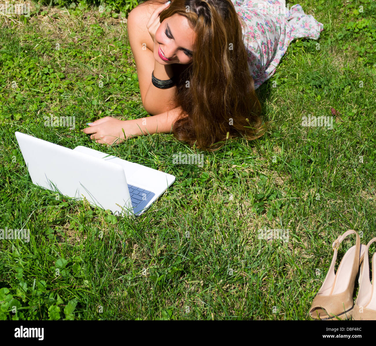 Beautiful girl with a laptop outdoor Stock Photo - Alamy