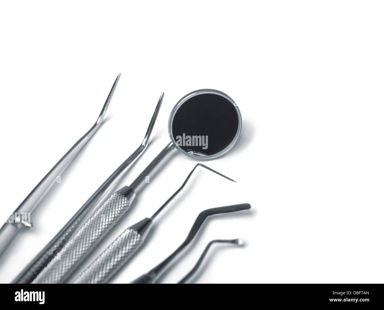 Dental instruments closeup isolated over white Stock Photo - Alamy