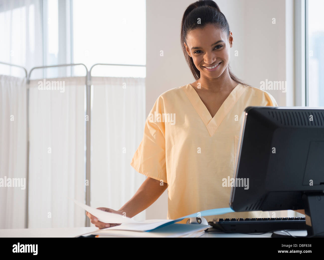 Nurse in scrubs using hi-res stock photography and images - Alamy
