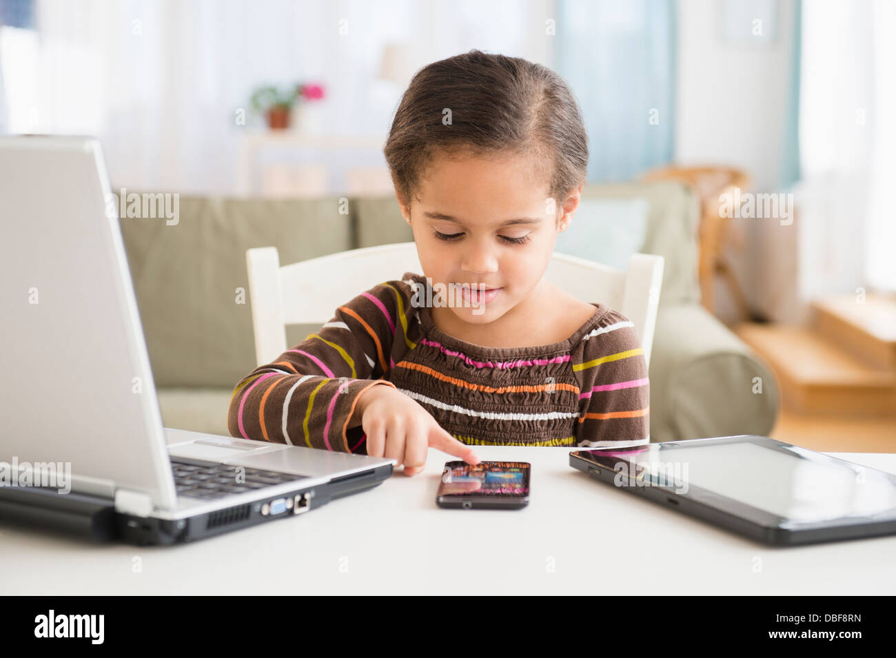 Girl sitting table checking new hi-res stock photography and images - Alamy