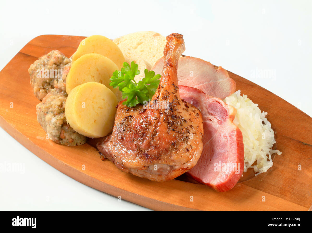 Roast duck and pork meat with three kinds of dumpling and white cabbage ...