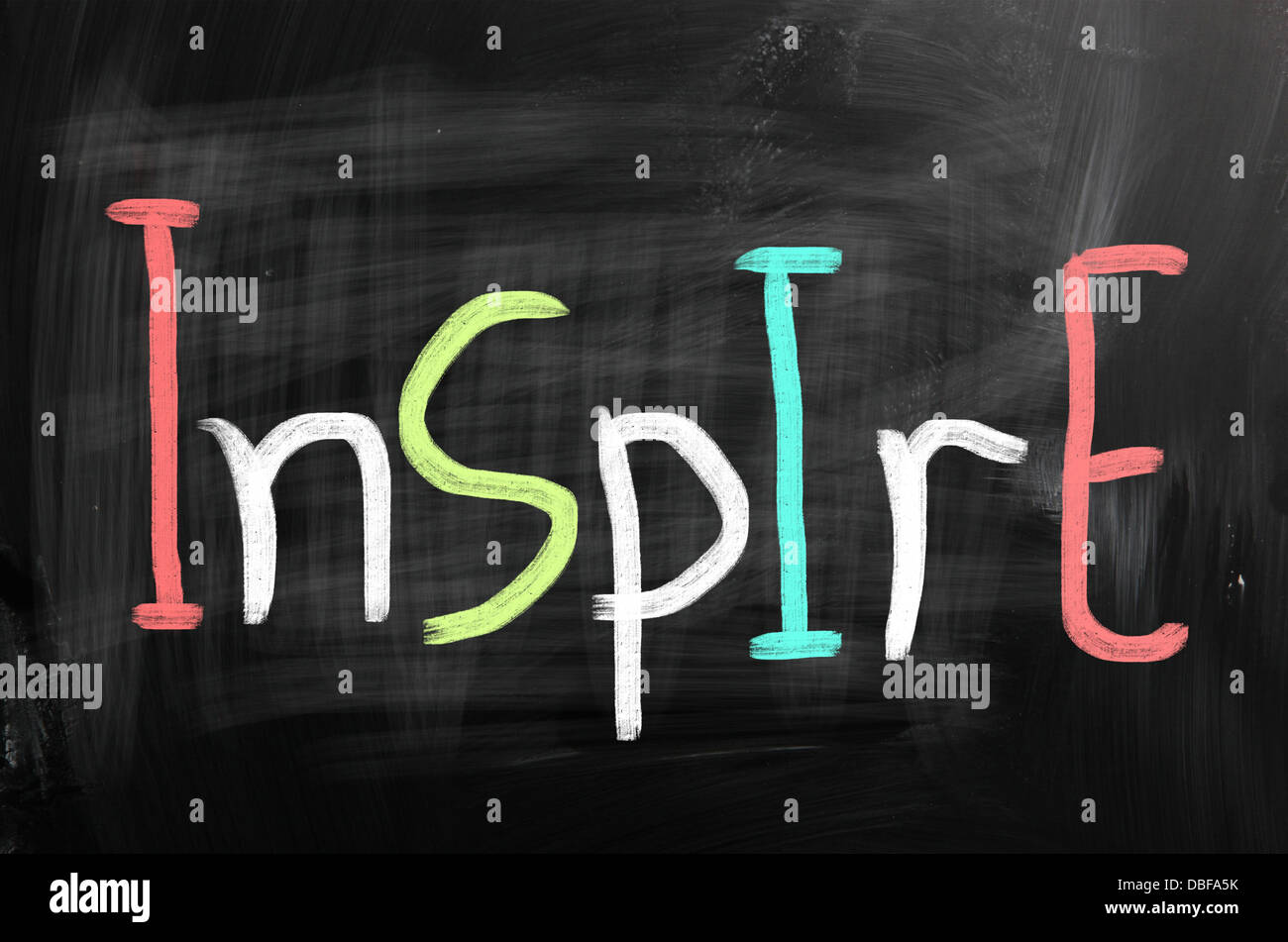Inspire handwritten with chalk on a blackboard Stock Photo - Alamy