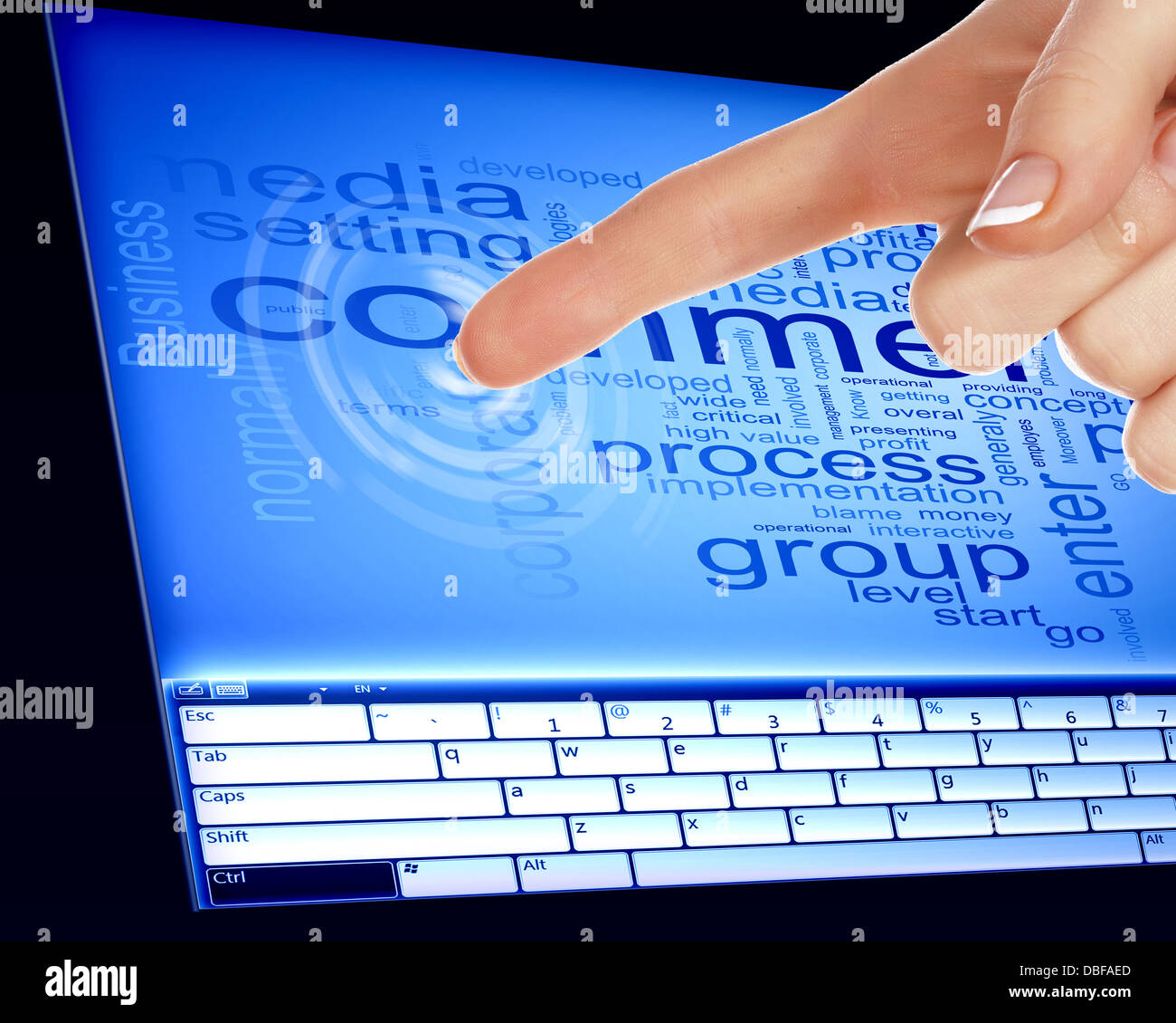 Finger touching a blue computer screen Stock Photo - Alamy