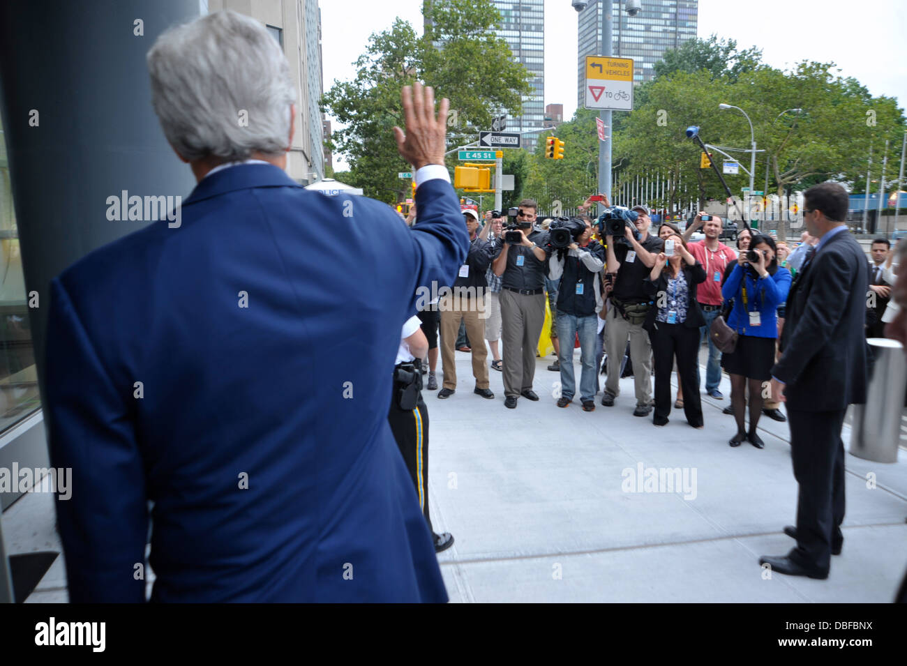 Secretary Kerry Waves to Reporters Stock Photo - Alamy