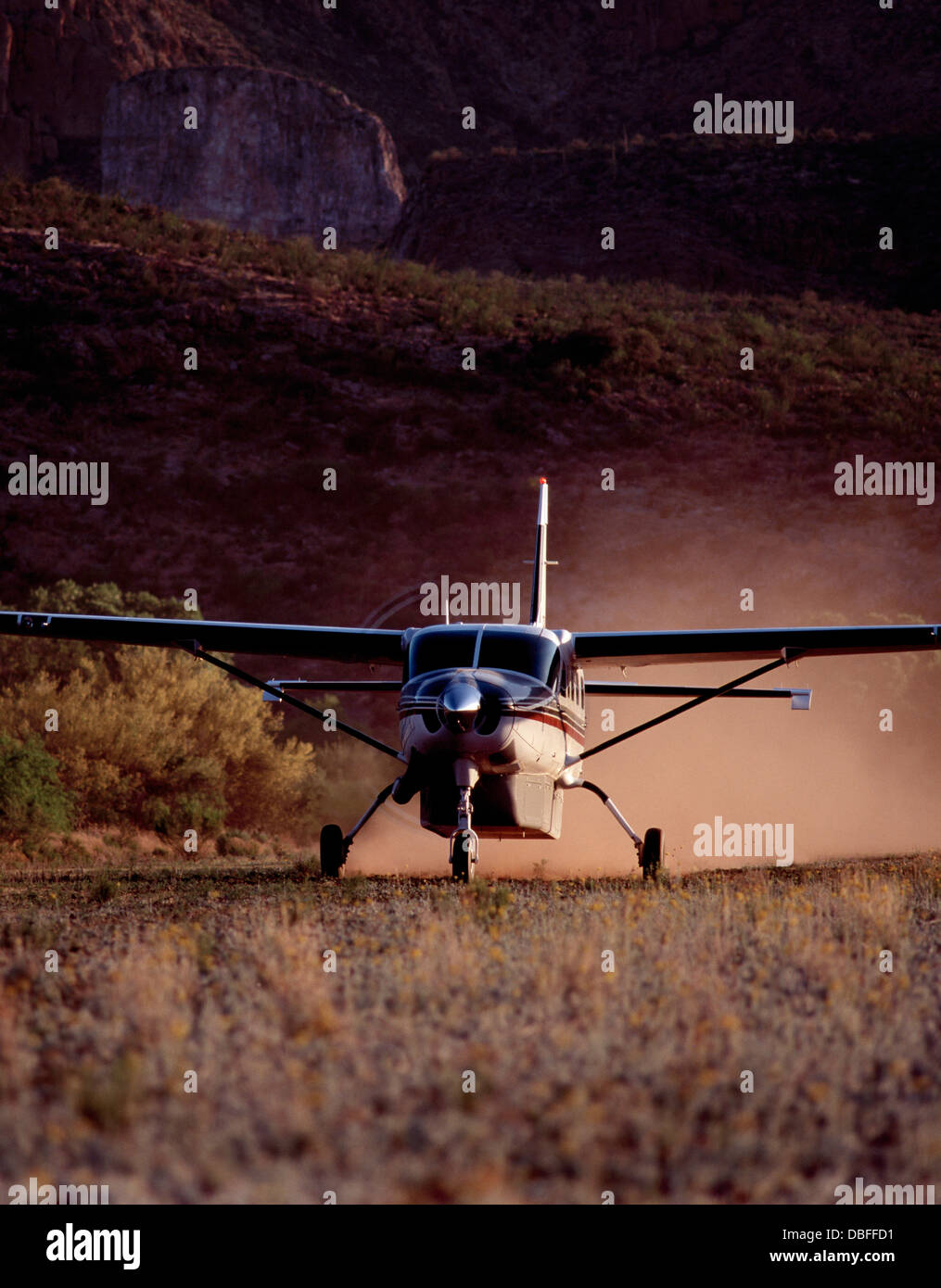 A Cessna Caravan charges down a remote airfield during a take-off roll ...