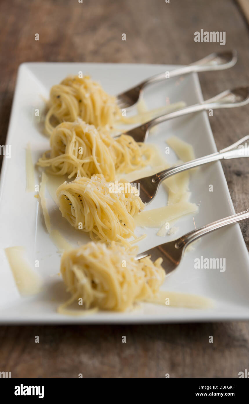 Tray of rolled pasta on forks Stock Photo - Alamy