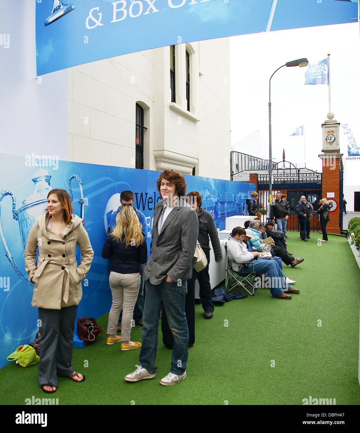 Tennis fans queue outside the Queens Club for £10 tickets to see the ...