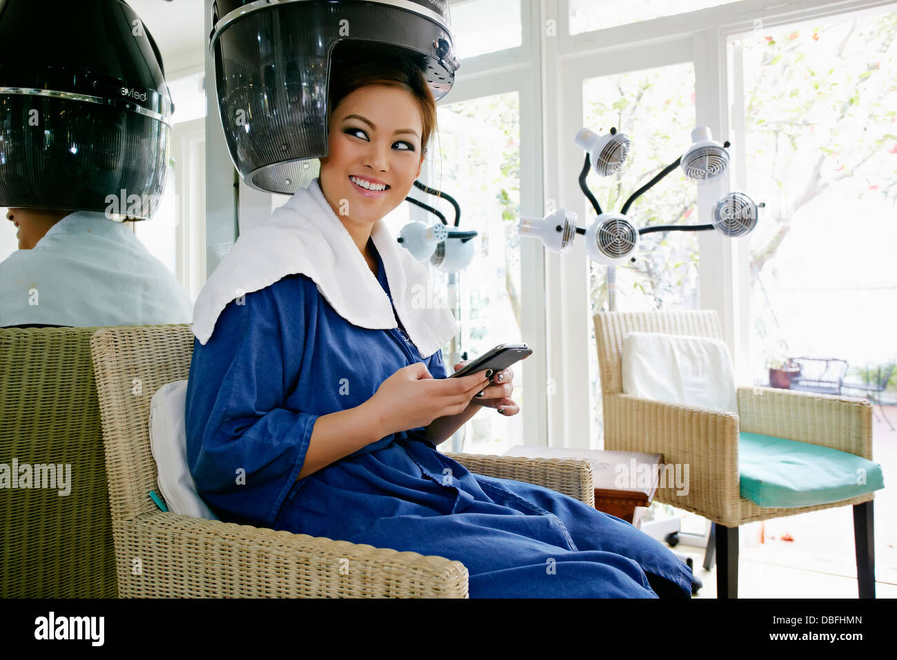 Woman having hair done hi-res stock photography and images - Alamy