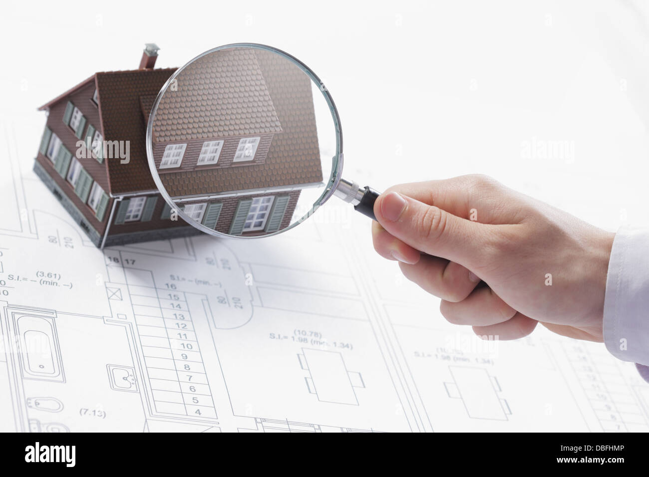 Magnifying glass and house Stock Photo - Alamy