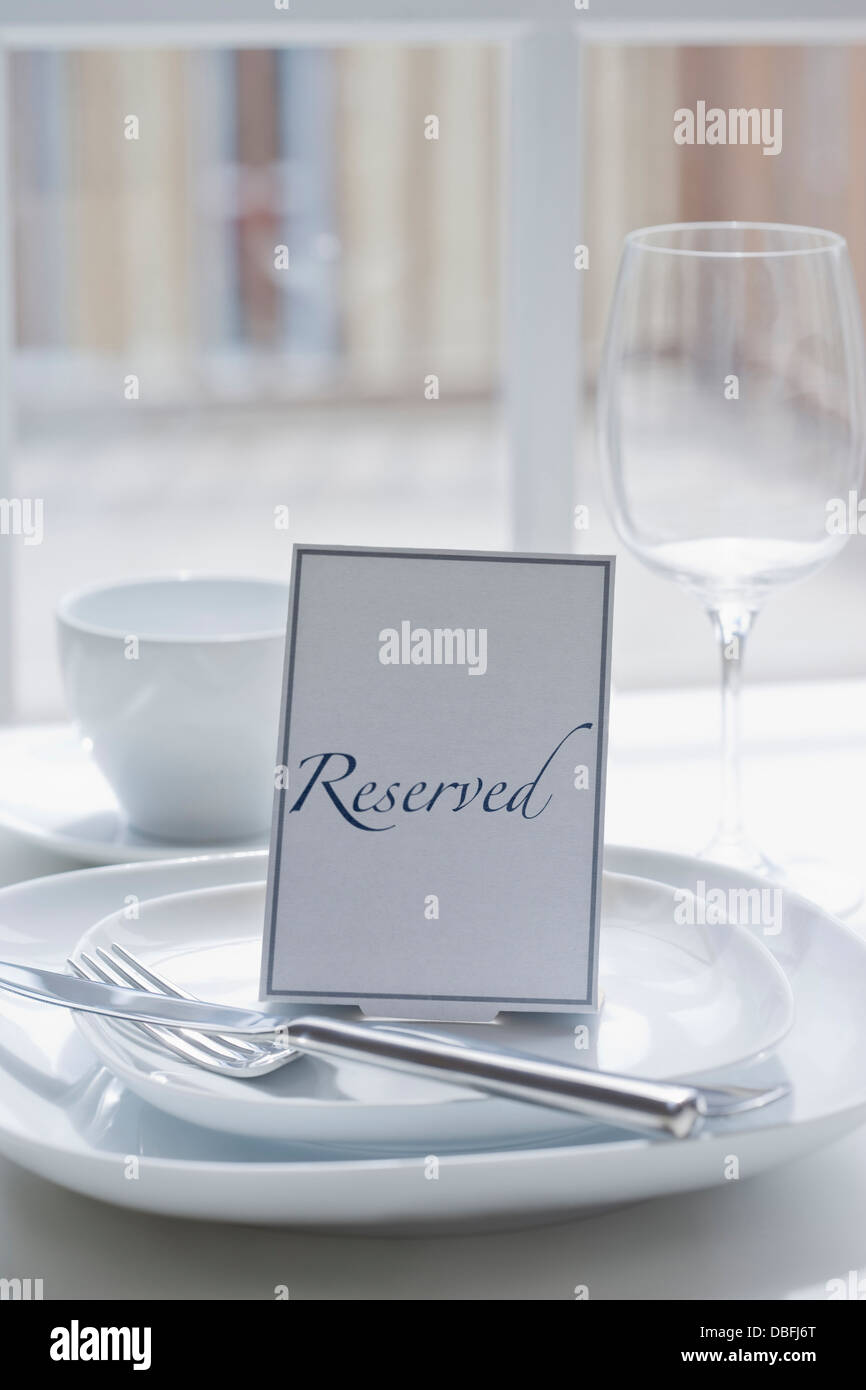 'Reserved' place setting at table Stock Photo - Alamy