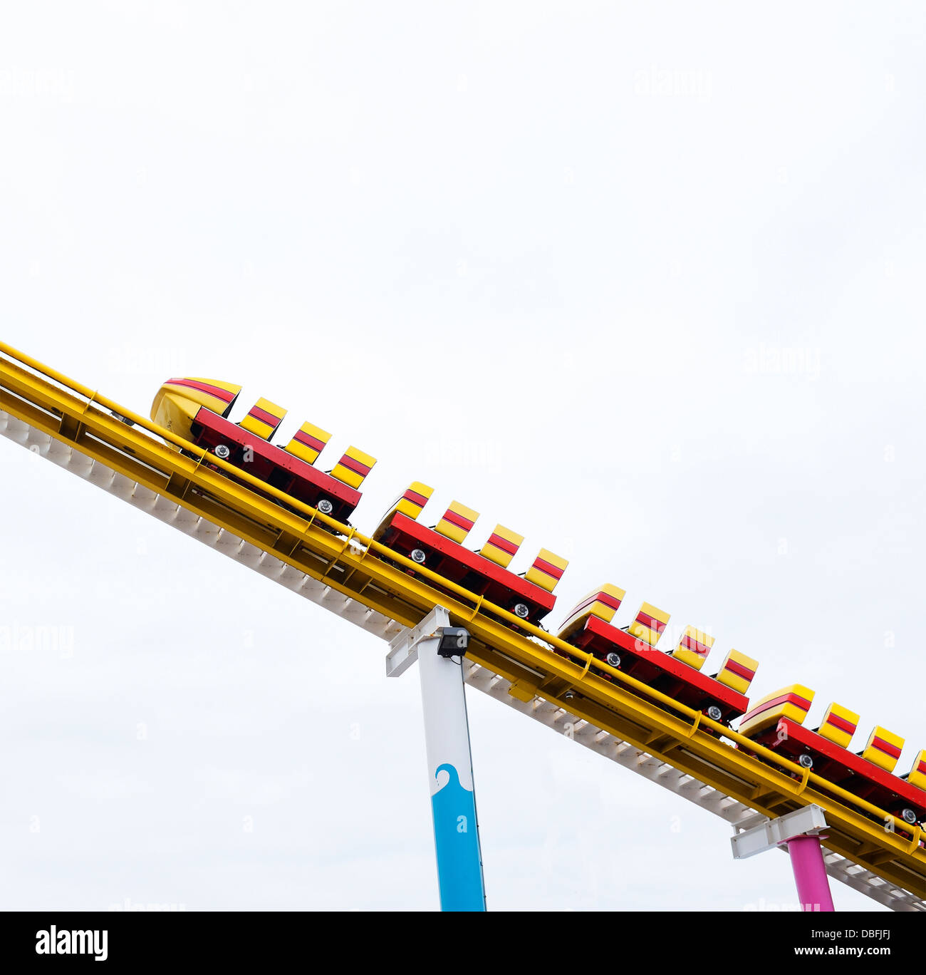 Roller coaster climbing hill Stock Photo - Alamy