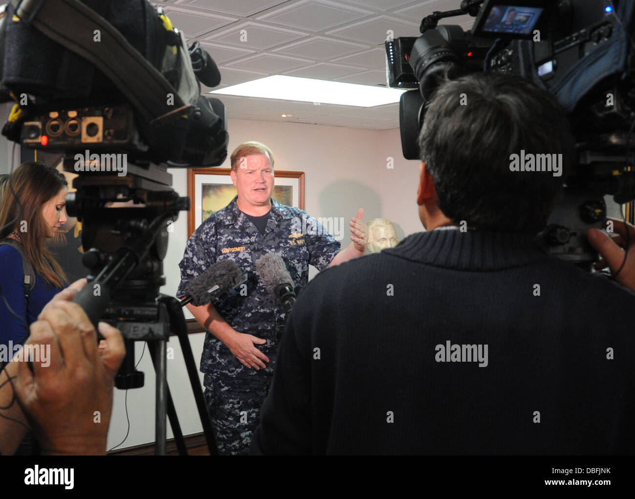 Rear Adm. Mark Montgomery, commander, Battle Force 7th Fleet, speaks to ...