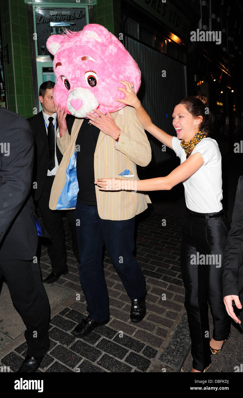 Stephen Fry wearing an oversized pink Care-Bear head and Margo Stilly ...